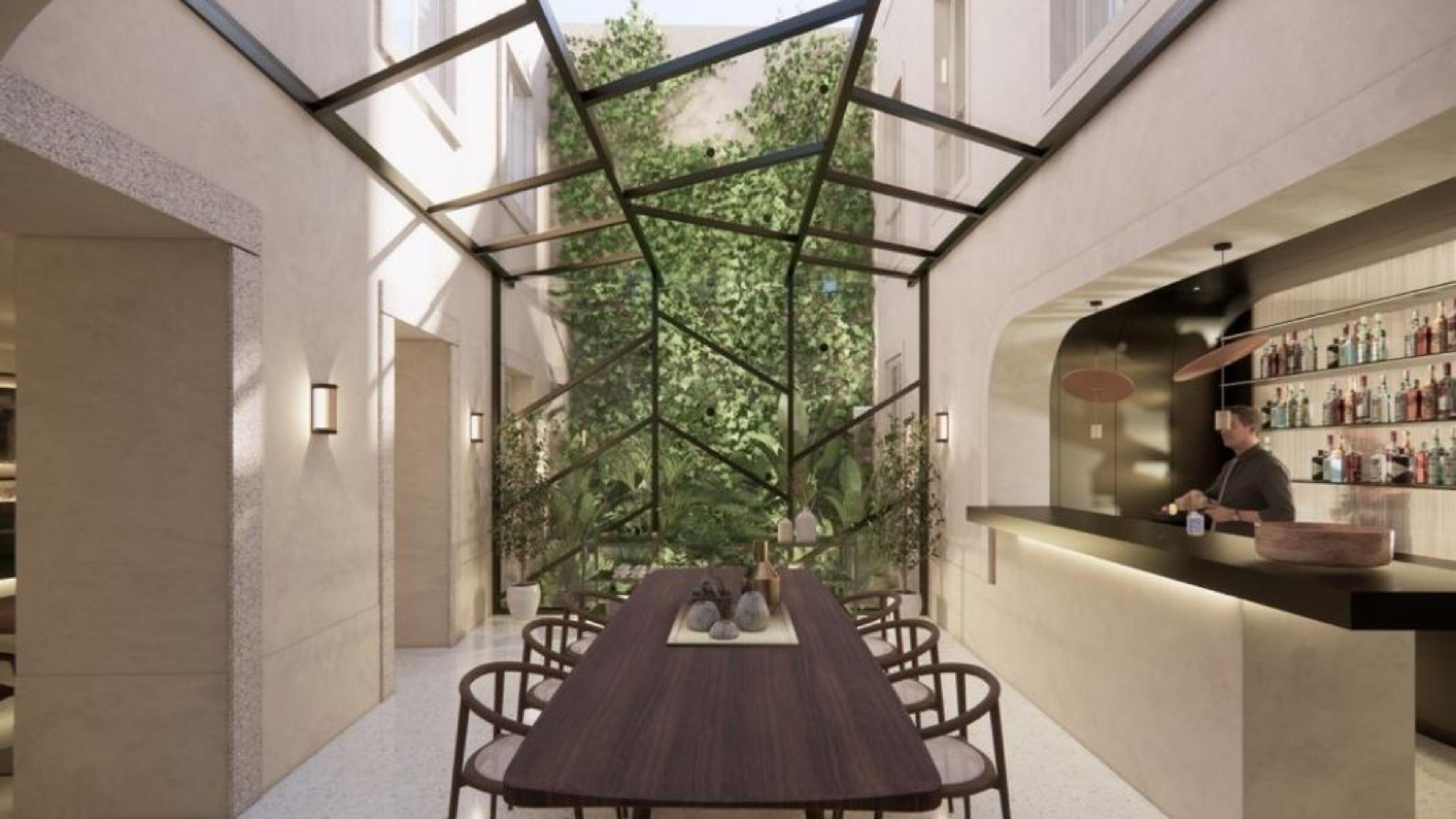 Um interior moderno com uma mesa de jantar comprida, um espaço de bar e vista através de uma estrutura de vidro geométrica.