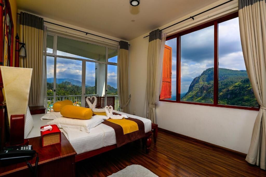 Quarto Duplo de Luxo, varanda, vista para a montanha | Secretária adequada para computadores portáteis, Wi-fi grátis 
