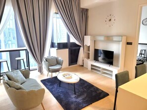 Apartamento, 1 quarto, vista para a cidade | Área de estar