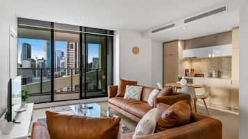 Apartamento Deluxe, varanda, Vista para a cidade | Sala de estar