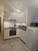 Apartamento conforto, sacada | Cozinha privada