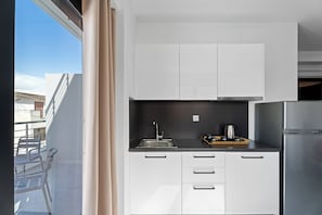 Apartamento, Vista para a cidade | Cozinha privada