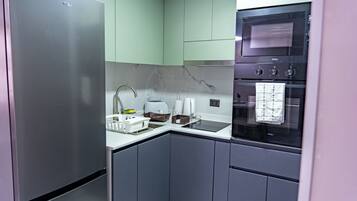 Apartamento Deluxe, Vista para a cidade | Cozinha privada