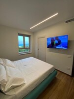 Suite Júnior, varanda, vista para o pátio | Cofre no quarto, Wi-fi grátis 