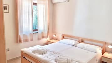 Apartamento família | Berços (sobretaxa), Wi-Fi de cortesia, roupa de cama