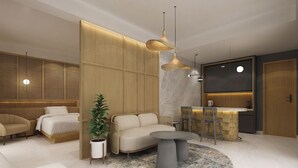 Quarto de hotel moderno com sofá, área de refeições e uma televisão grande.