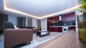 Apartamento Deluxe, varanda, Vista para a cidade | Sala de estar