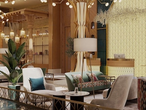 Um hall moderno com áreas de estar, balcão de recepção e iluminação decorativa.