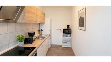 Apartamento | Cozinha privada | Uma cadeira de bebé
