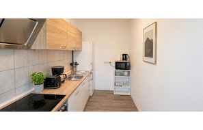 Apartamento | Cozinha privada | Uma cadeira de bebé 