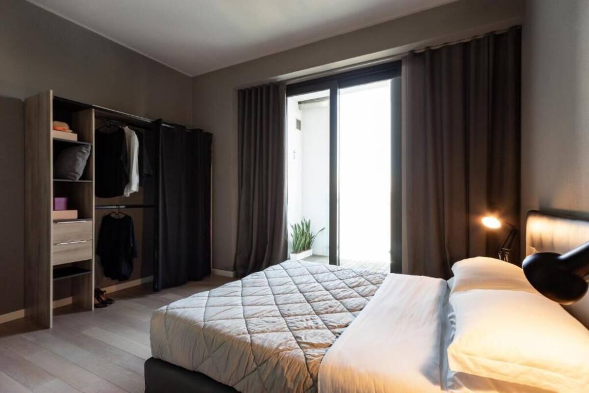 Apartamento Deluxe, 2 quartos (Trilocale Deluxe) | Cortinas/cortinados opacos, quartos insonorizados