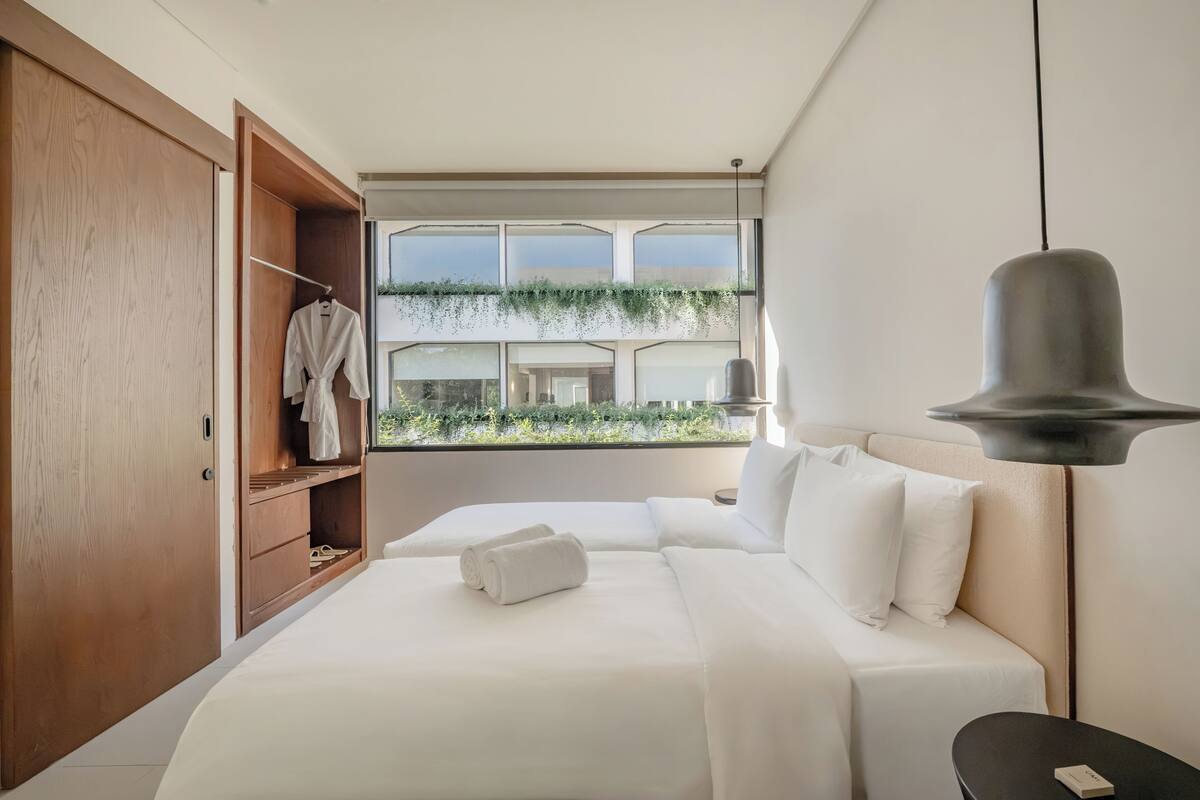 Suite Familiar | Minibar, ferro/tábua de engomar, Wi-fi grátis, roupa de cama fornecida