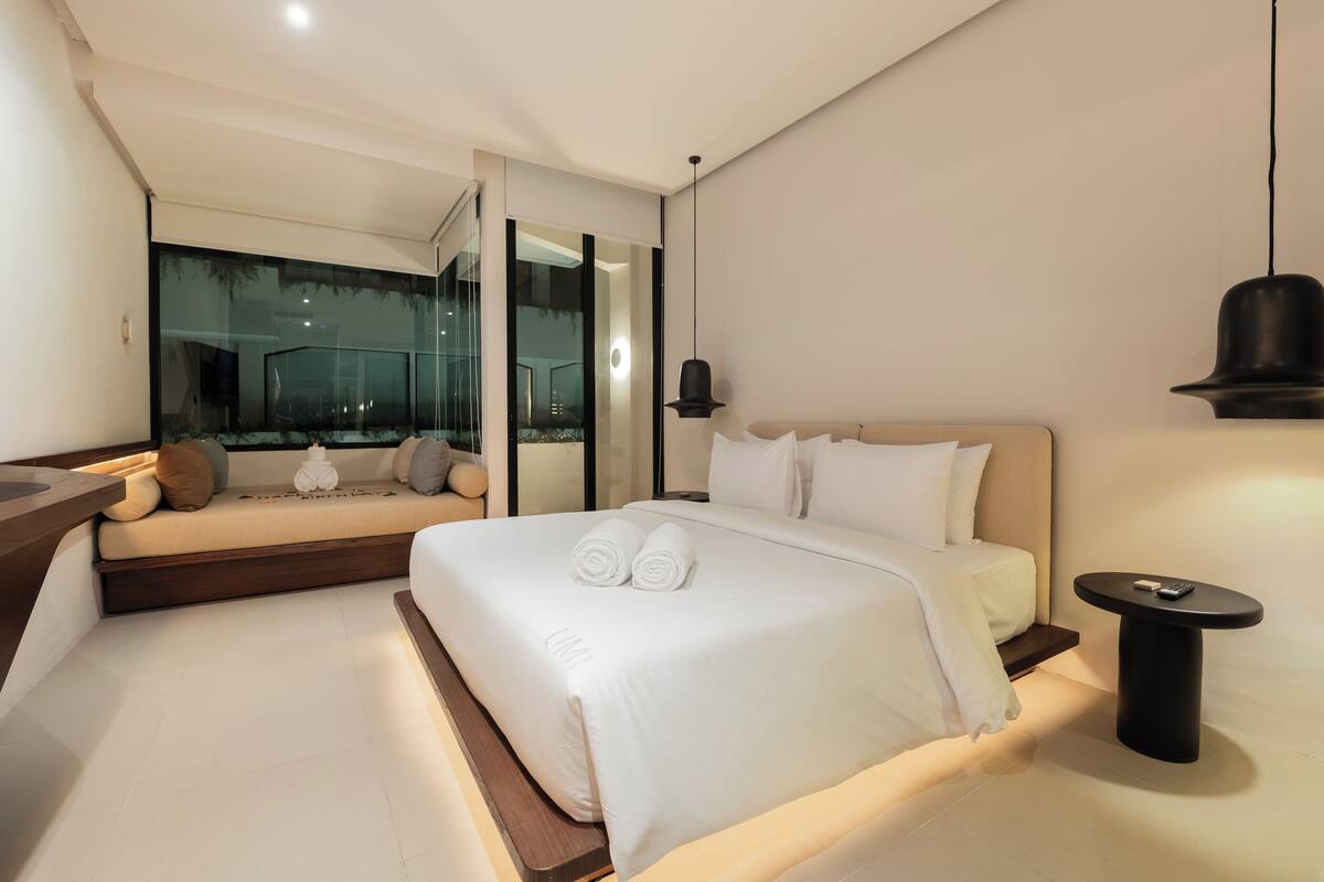 Suite Superior | Minibar, ferro/tábua de engomar, Wi-fi grátis, roupa de cama fornecida