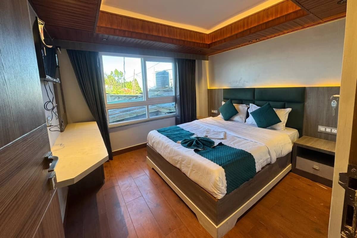 Quarto premium, vista para a colina | Roupa de cama