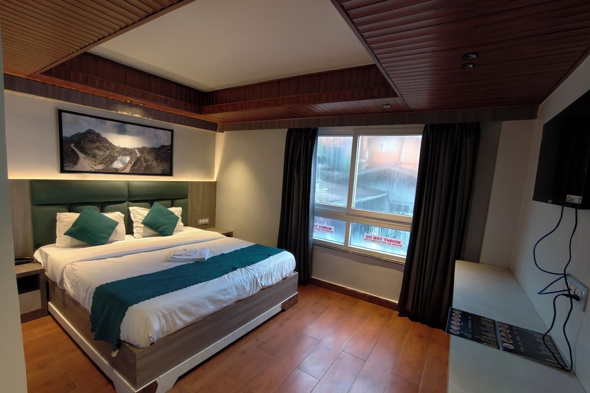 Quarto luxo, vista para a cidade | Roupa de cama