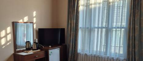 Condo família, sacada, vista para a cidade | Frigobar, quartos à prova de som, ferros/tábuas de passar roupa