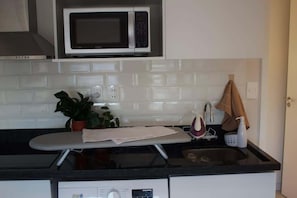 Apartamento, varanda, Vista para a cidade | Cozinha privada