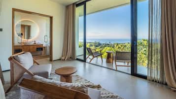 Suíte superluxo, vista para o mar | Área de estar | Smart TV 55 polegadas com canais digitais