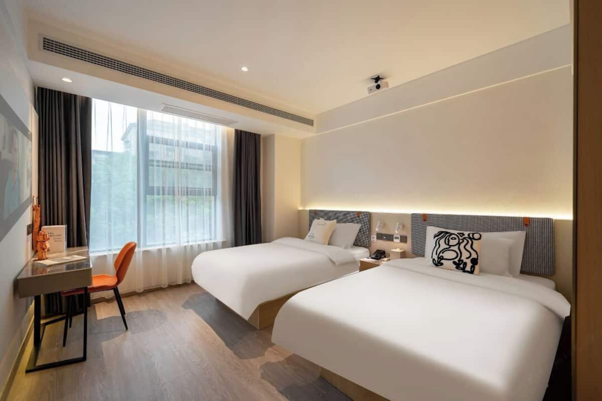Quarto duplo superior | Frigobar, cortinas blackout, Wi-Fi de cortesia, roupa de cama