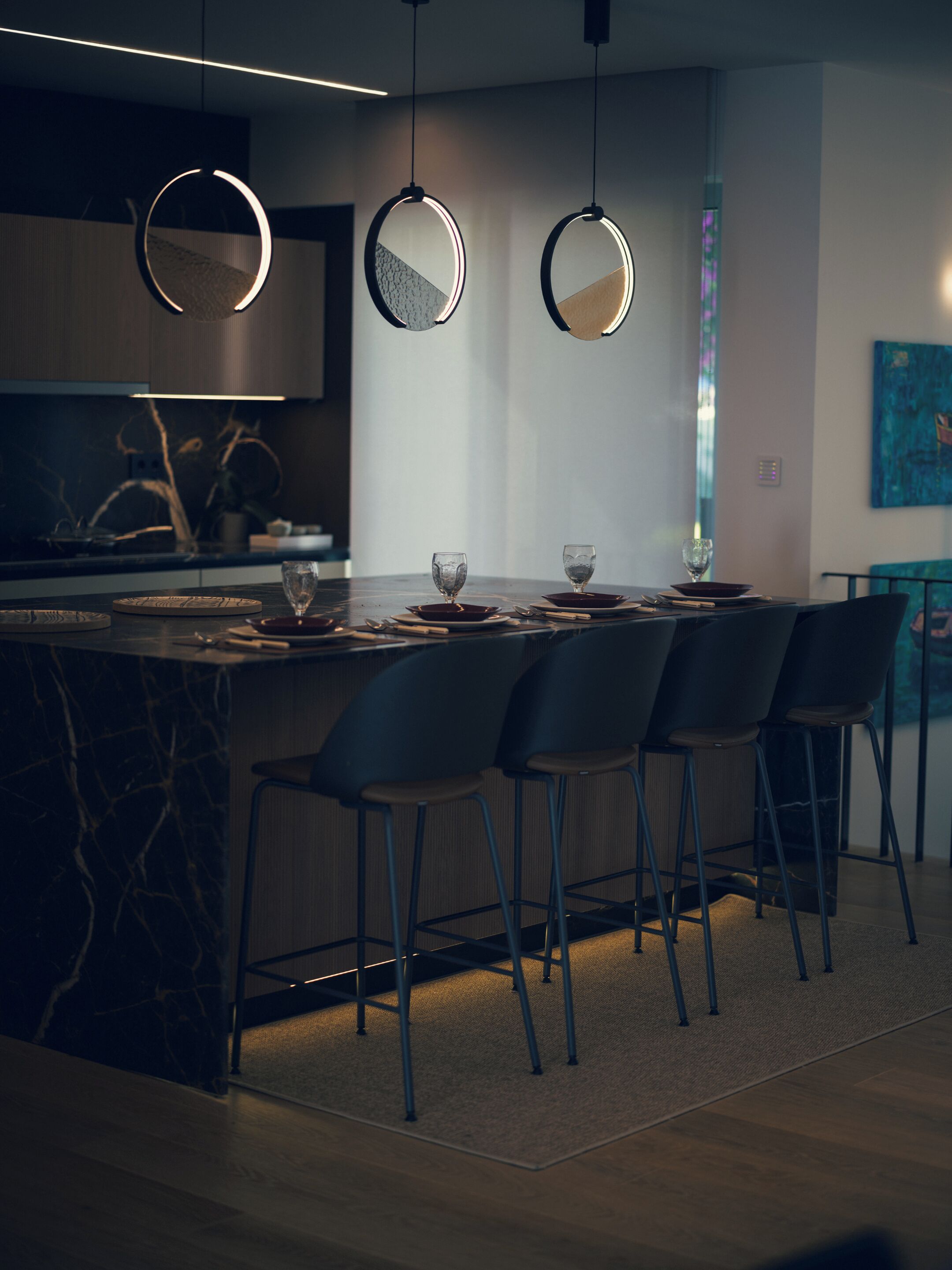 Uma cozinha moderna com bancada de mármore, espelhos circulares pendurados e banquetas de bar.