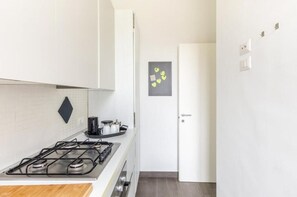 Apartamento, sacada | Cozinha privada
