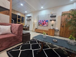 Quarto Duplo Deluxe, varanda, Vista para a cidade | Sala de estar