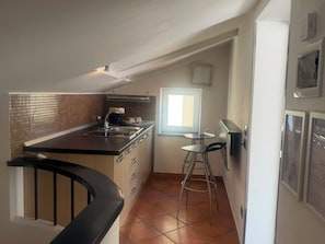 Apartamento, sacada | Cozinha privada