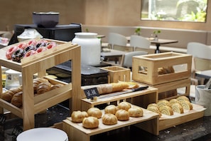 A bakery display with various baked goods.