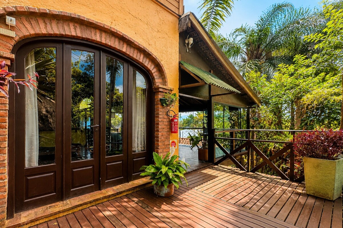 Casa Lírio da Paz com Lareira - Oasys Floripa | Vista para o jardim