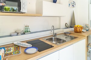 Apartamento, pátio | Cozinha privada