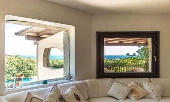Quarto casal ou duplo luxo, vista para a piscina | Área de estar