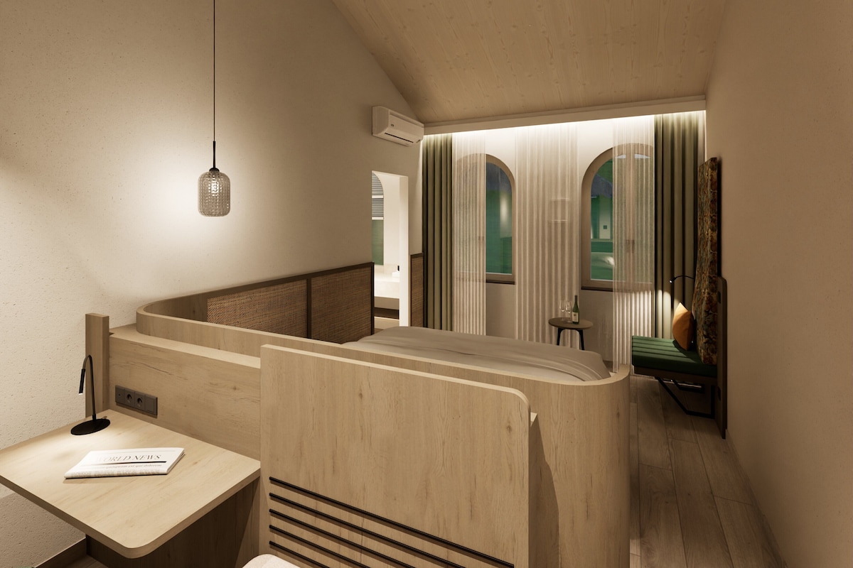 Um interior moderno com um banco de madeira, uma pequena mesa com um livro e uma janela com cortinas.