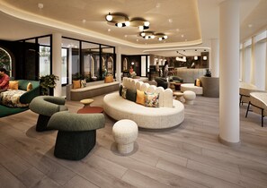 Uma área de estar moderna com assentos, um bar e vista para o exterior.