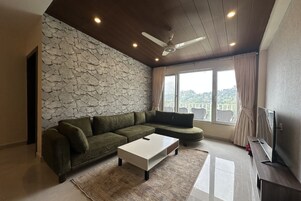Apartamento, vista para a montanha | Área de estar