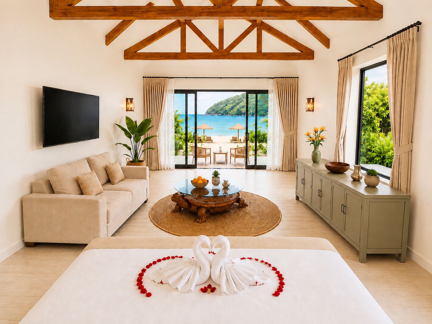 Quarto de hotel com cama grande, sofá, televisão e vista para a praia.