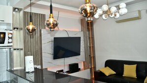 Apartamento conforto, sacada | Área de estar
