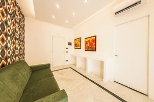 Suite, varanda | Sala de estar
