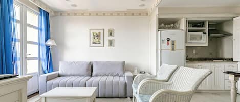 Apartamento Básico | Sala de estar | Televisor de 40 polegadas com canais digitais