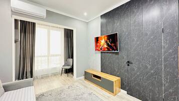 Apartamento, vista para a montanha | Área de estar