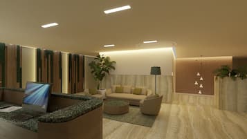 Uma área de recepção moderna com balcão, computador, assentos e plantas decorativas.