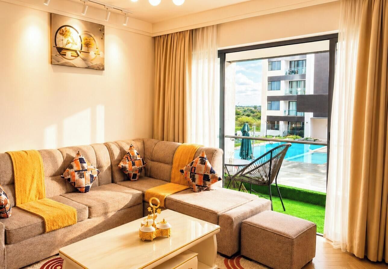Apartamento Deluxe, vista para a piscina | Sala de estar