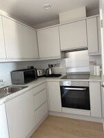 Quarto Deluxe, varanda, vista para o mar | Sala de estar