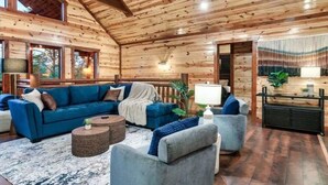Cabana, vários quartos | Área de estar | Smart TV