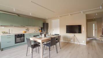 Apartamento família, vista para a cidade | Cozinha privada