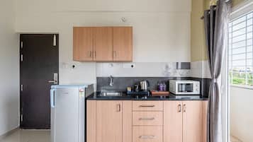 Quarto Duplo Deluxe, Vista para a cidade | Cozinha privada