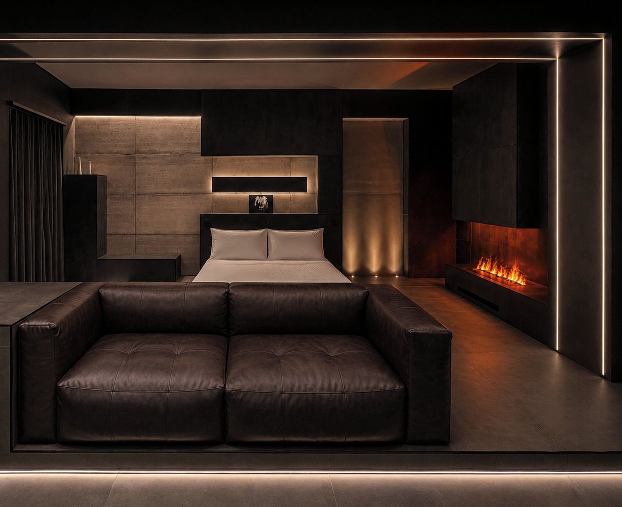 Quarto moderno com sofá, cama e lareira.