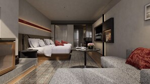 Quarto de hotel moderno com cama, área de estar, uma pequena mesa e televisão fixada na parede.