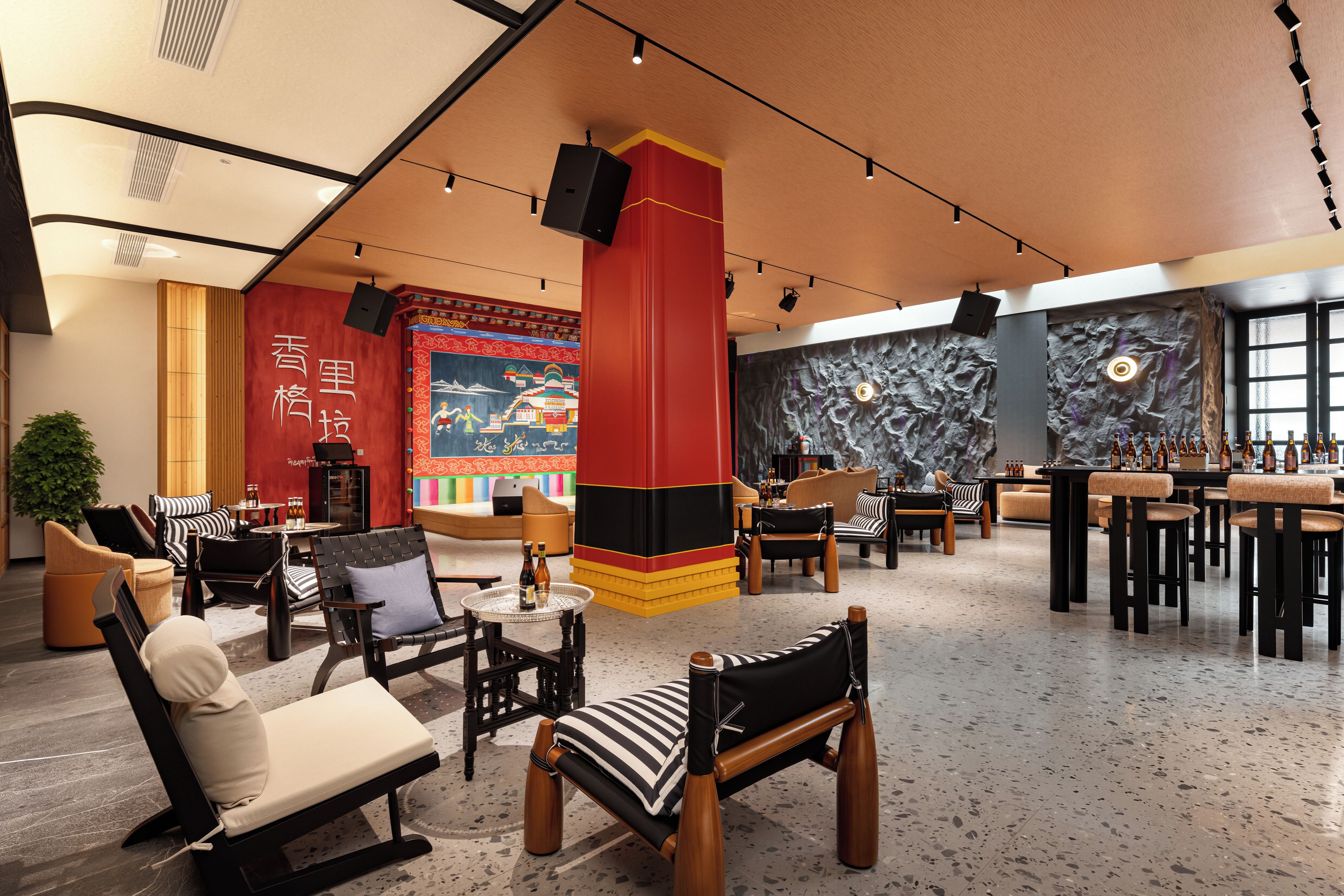 Uma área de estar moderna com disposição de assentos, um bar e elementos decorativos.