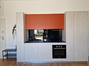 Apartamento família, vista para a cidade | Cozinha privada