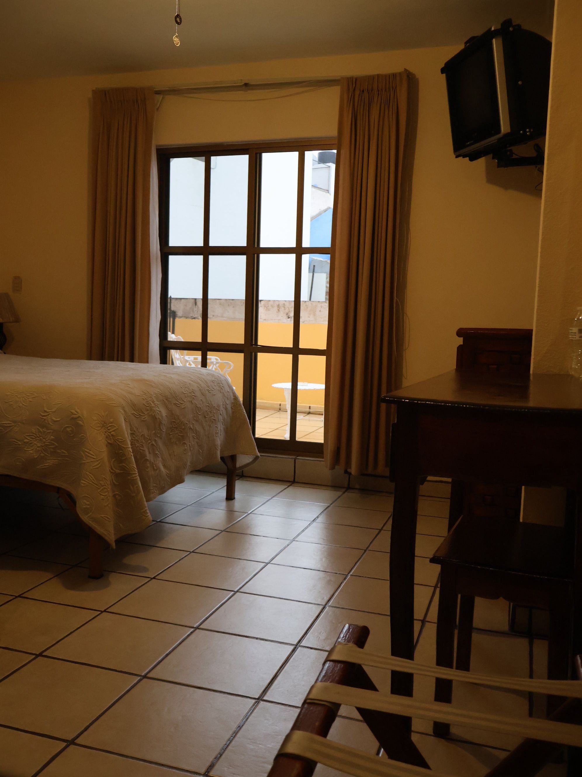 Quarto Duplo Comfort, Vista para a cidade | Cortinas/cortinados opacos, ferro/tábua de engomar, Wi-fi grátis 